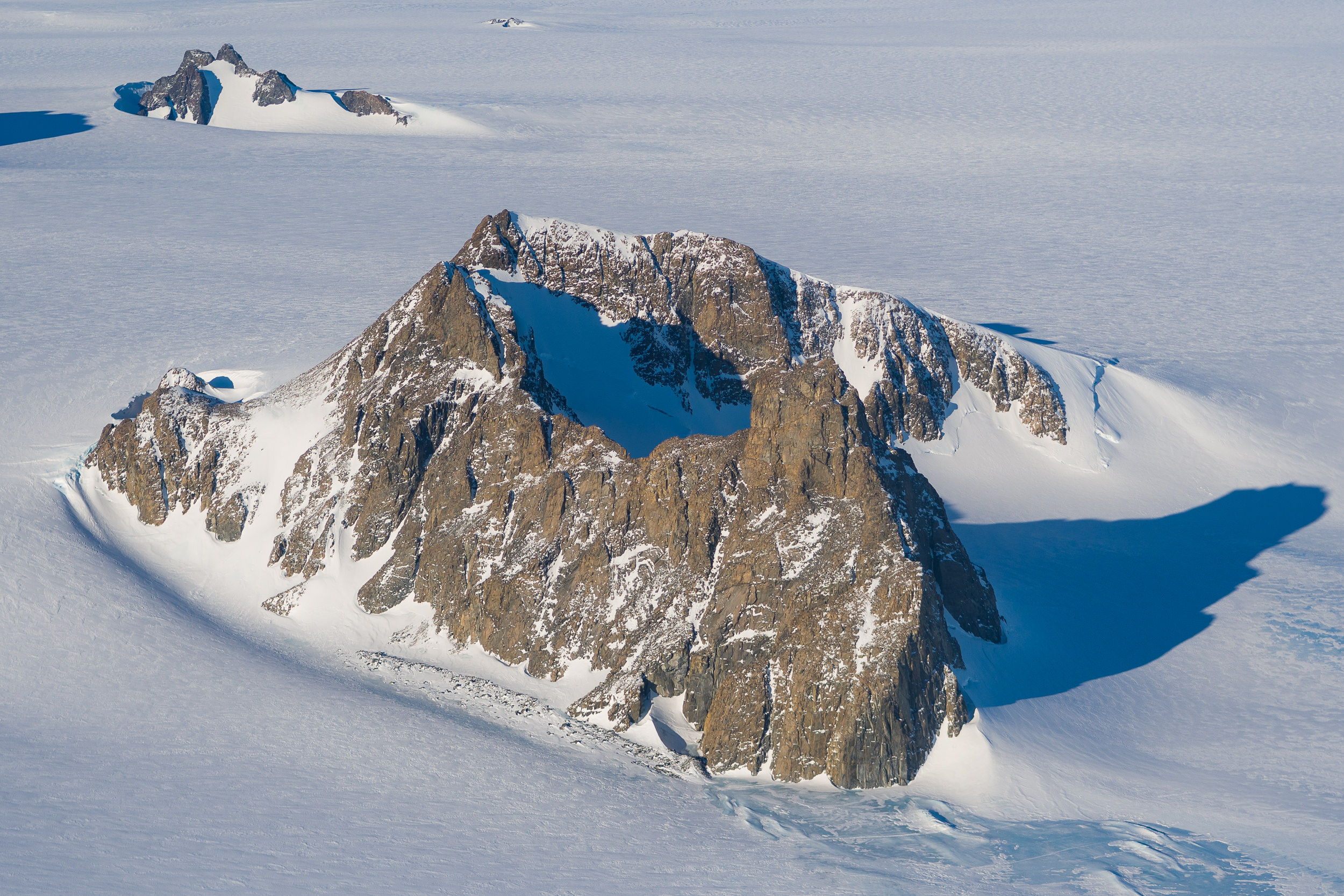 A cirque on the flank of the Dyer Plateau east of George VI Ice Shelf ...